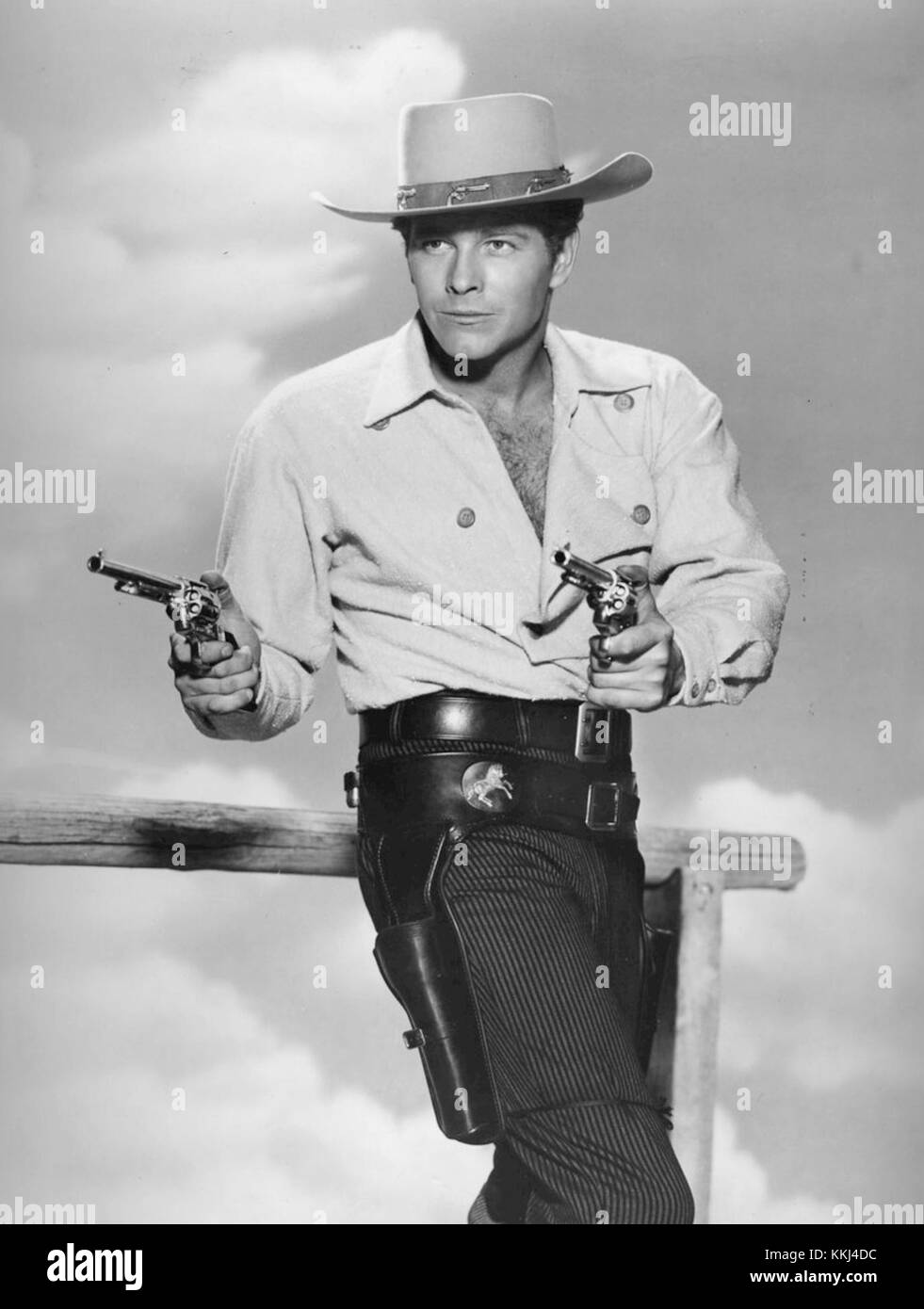 An image of Wayde Preston, an actor from the 1950s, with a Colt .45 handgun. The image likely ...