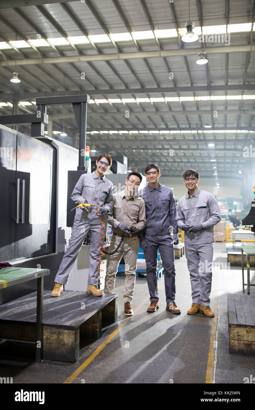Confident Chinese engineers in the factory Stock Photo - Alamy
