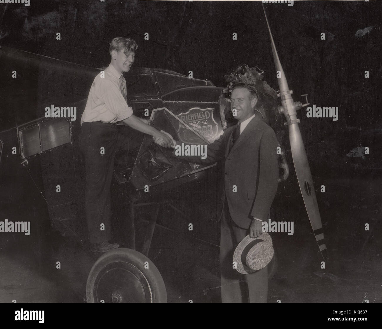 The photo captures Eddie August Schneider shaking hands with Richard ...