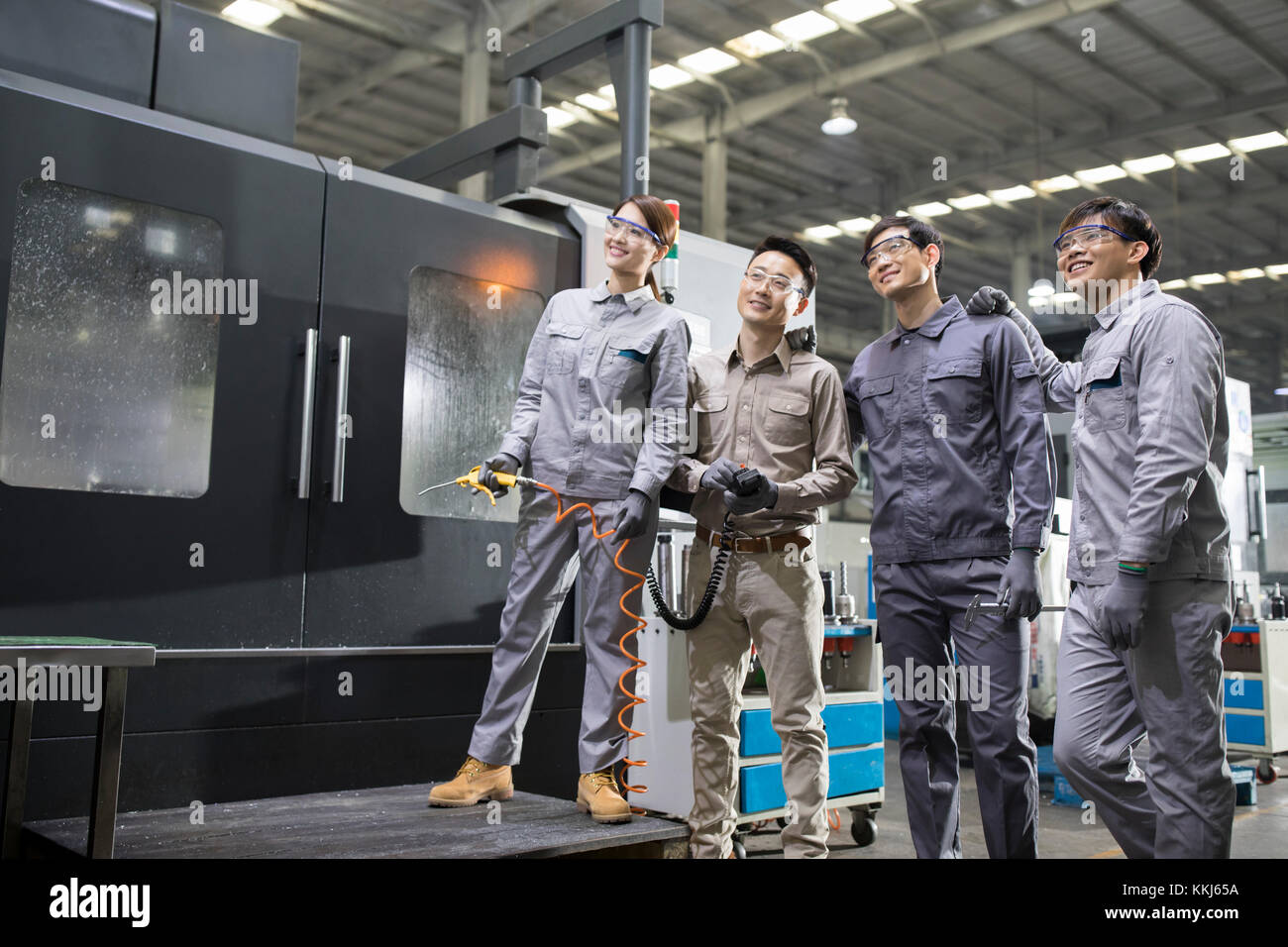 Confident Chinese engineers in the factory Stock Photo - Alamy