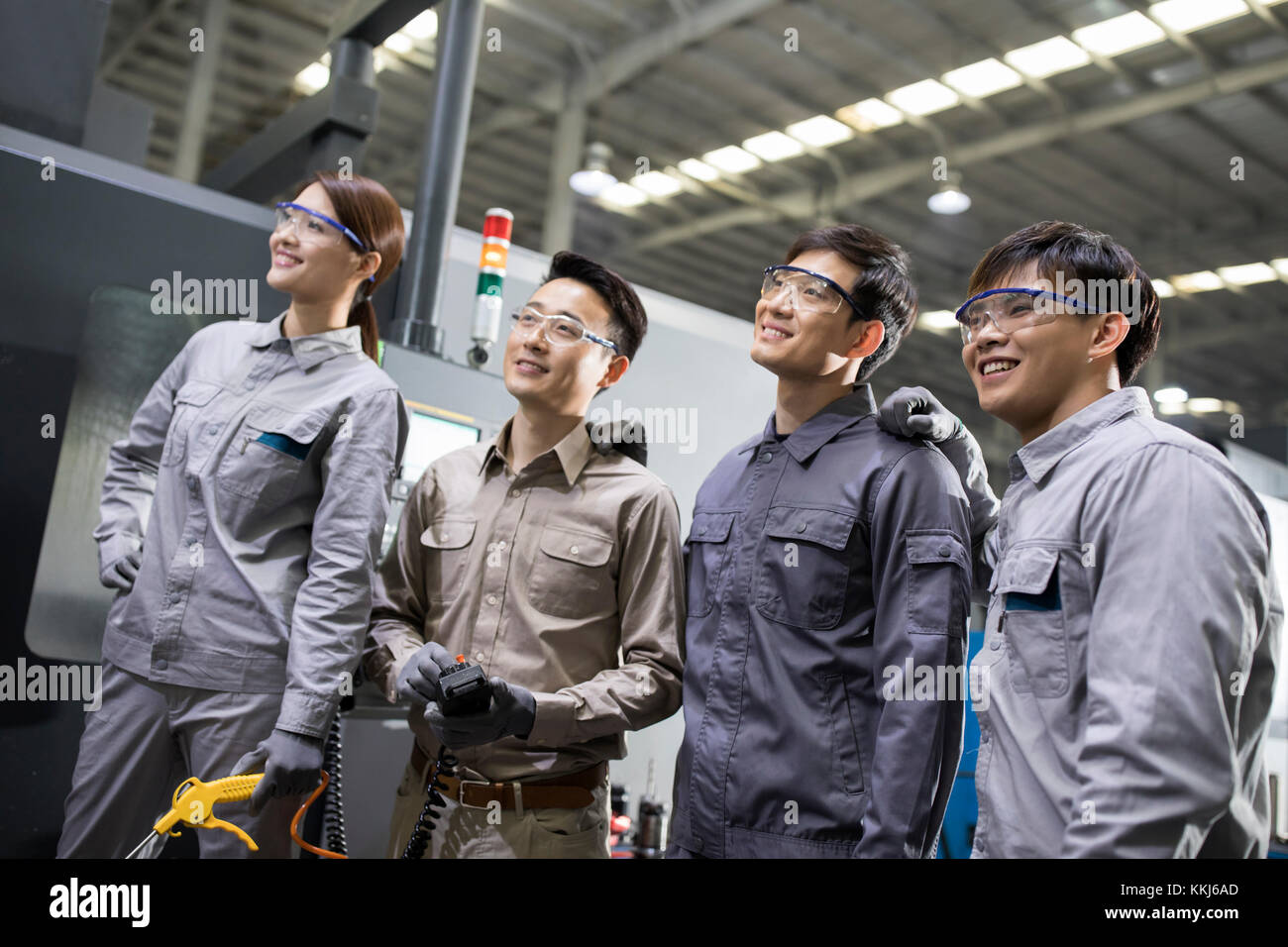 Confident Chinese engineers in the factory Stock Photo - Alamy