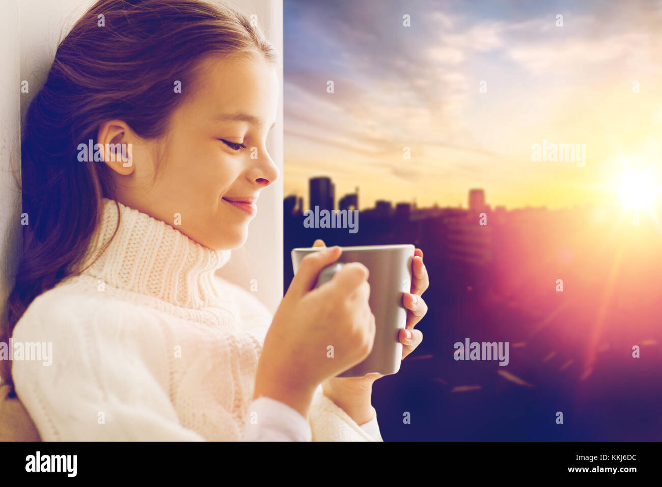 girl with tea mug sitting at home window Stock Photo - Alamy