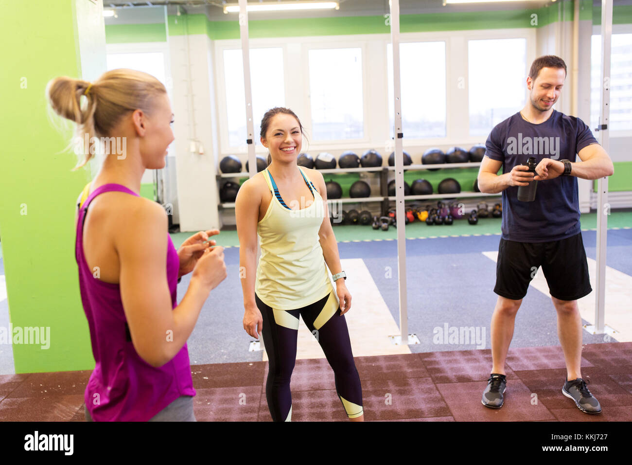 group of happy friends in gym Stock Photo - Alamy