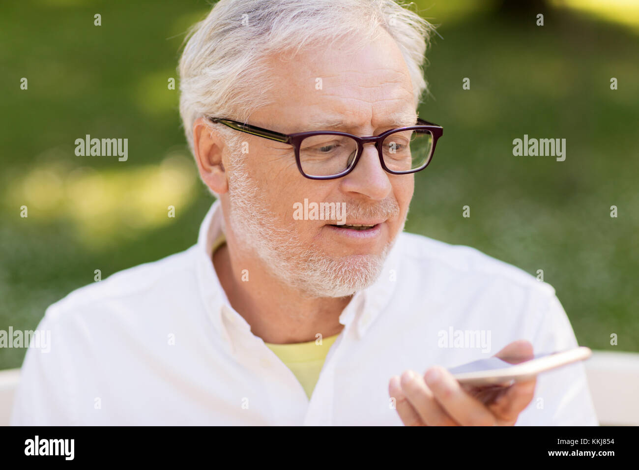 old man using voice command recorder on smartphone Stock Photo - Alamy