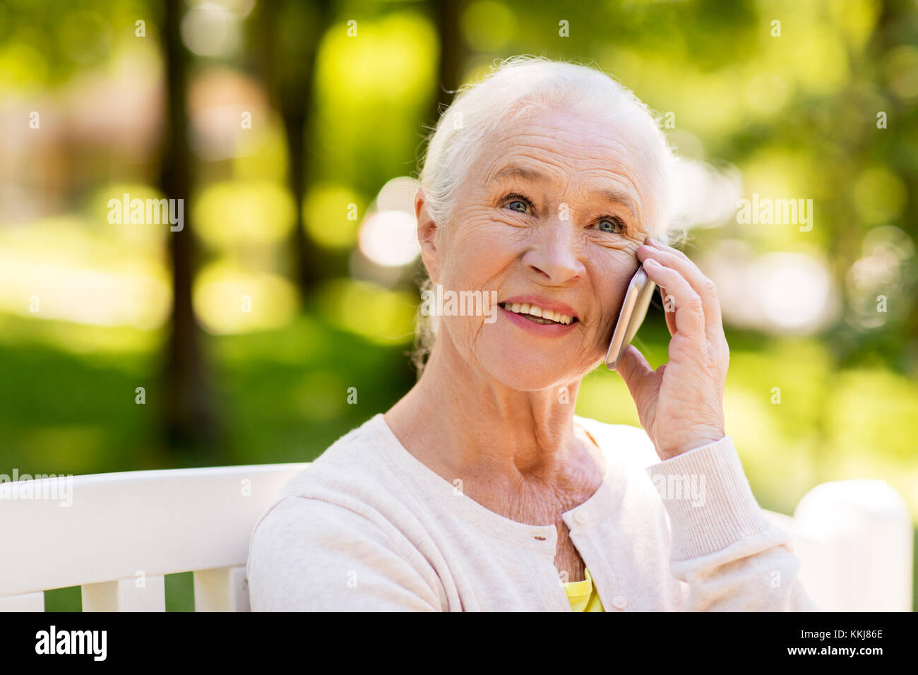 happy senior woman calling on smartphone in summer Stock Photo - Alamy