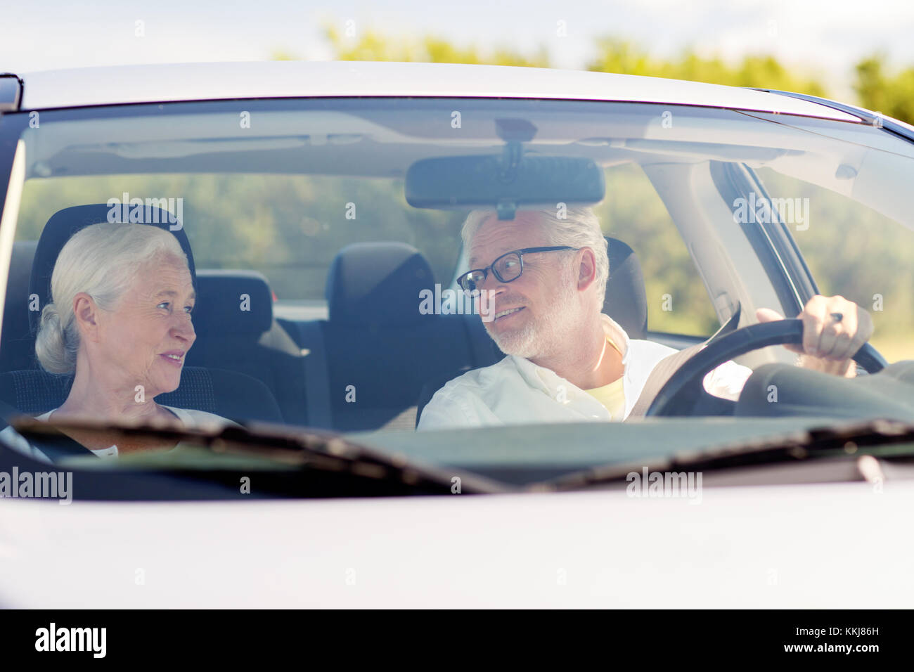 happy senior couple driving in car Stock Photo - Alamy
