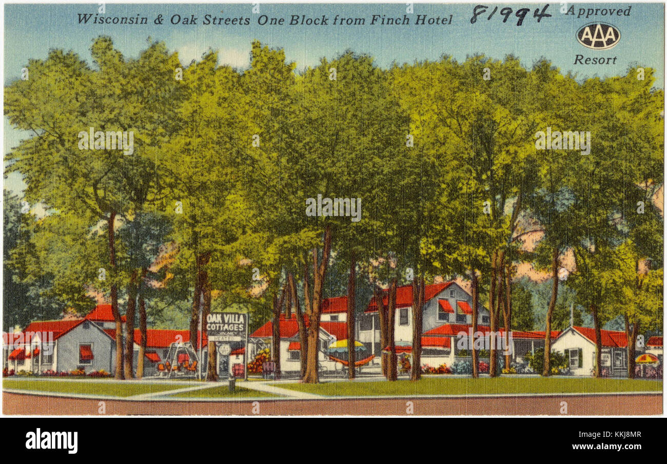 This historical photograph shows the intersection of Wisconsin and Oak ...