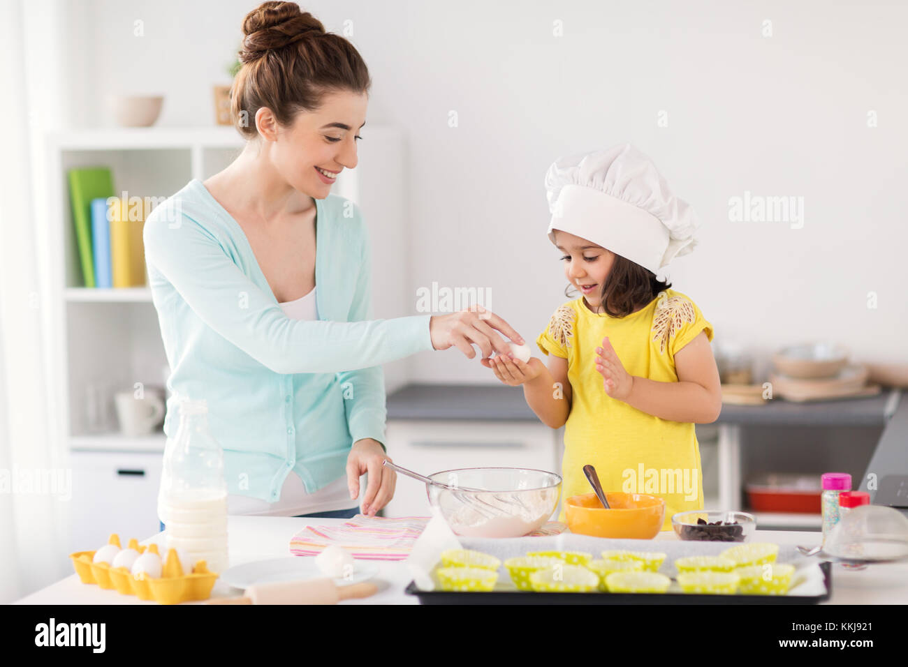 happy mother and daughter baking at home Stock Photo - Alamy