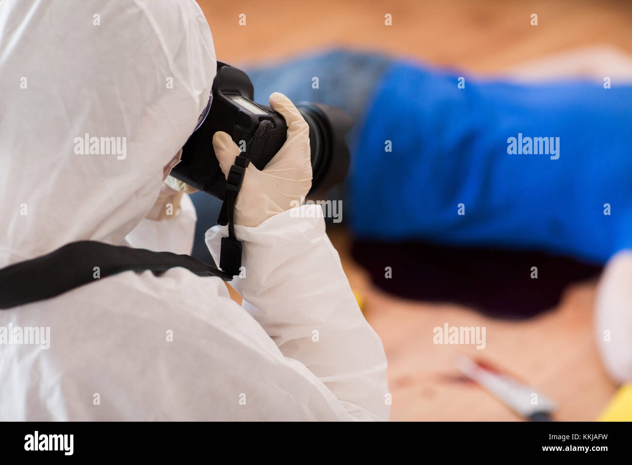 criminalist photographing dead body at crime scene Stock Photo - Alamy