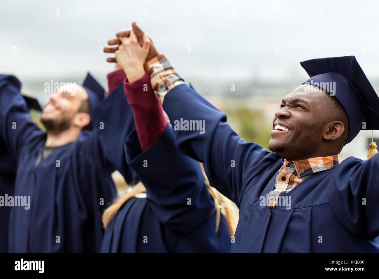 happy students celebrating graduation Stock Photo - Alamy