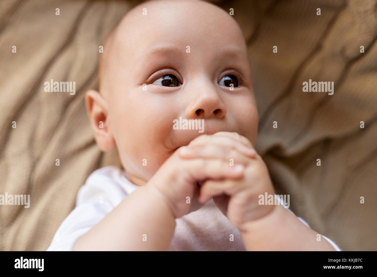 close up of sweet little baby boy lying on blanket Stock Photo - Alamy
