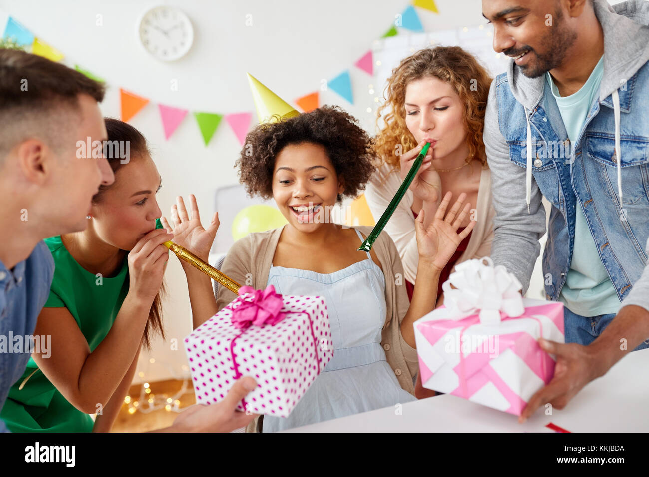 team greeting colleague at office birthday party Stock Photo - Alamy