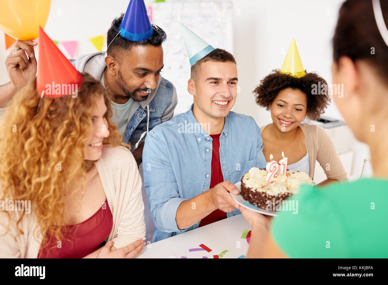 team greeting colleague at office birthday party Stock Photo - Alamy