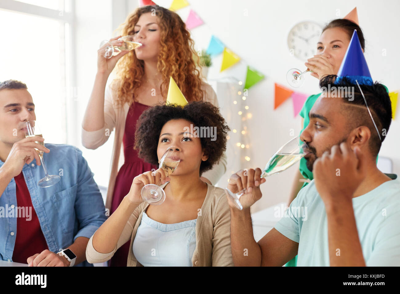 team drinking champagne at office birthday party Stock Photo - Alamy