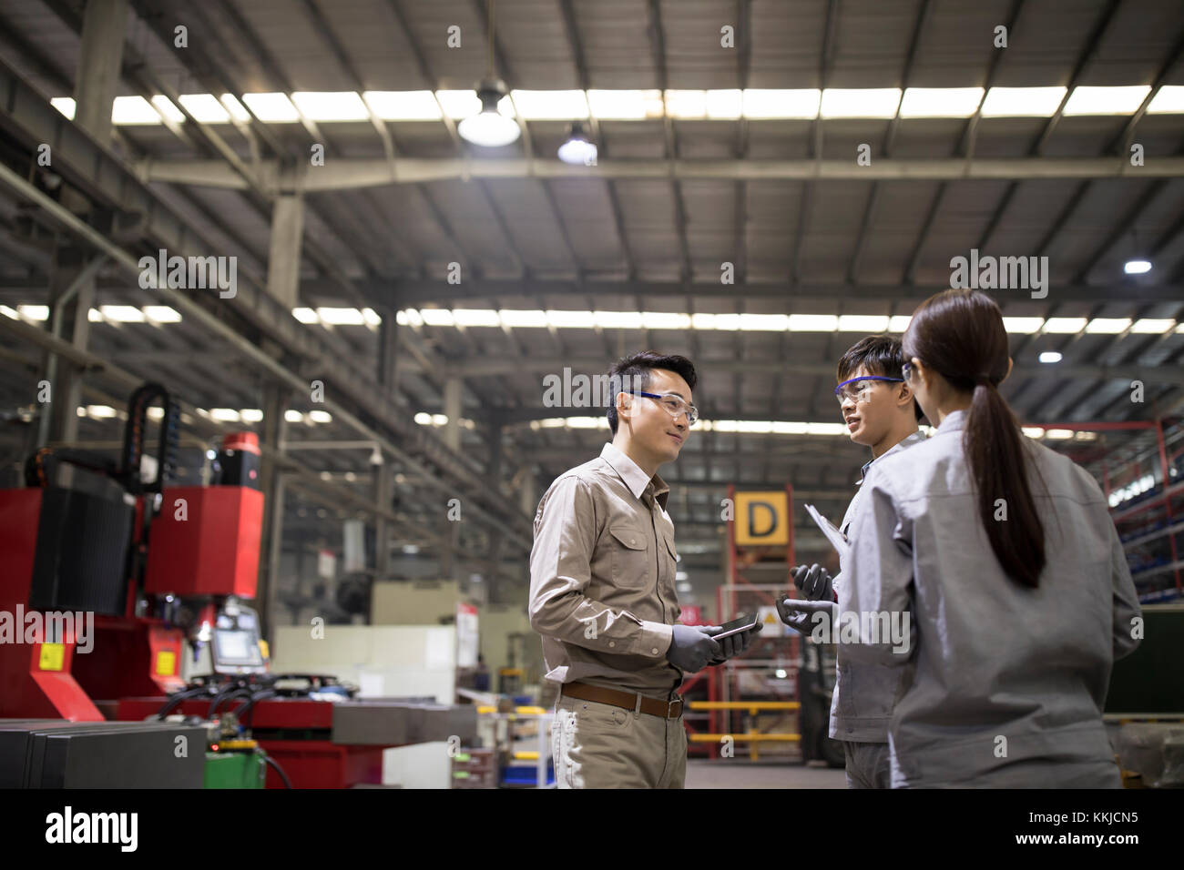 Engineers working digital equipment close hi-res stock photography and ...