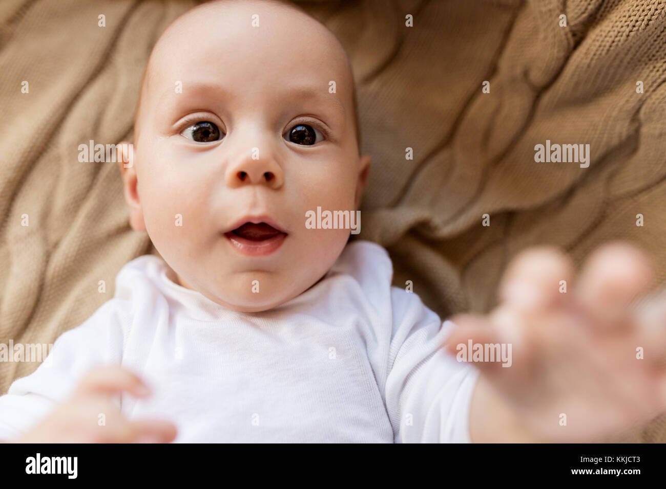 close up of sweet little baby boy lying on blanket Stock Photo - Alamy