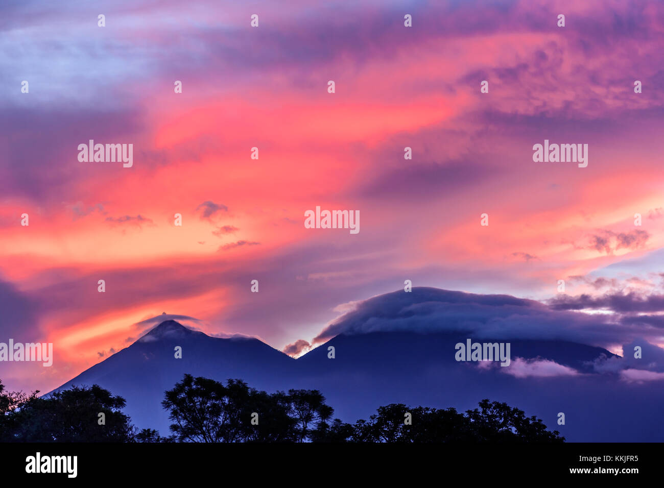 Colorful sunset behind Fuego volcano & Acatenango volcano, near Antigua ...