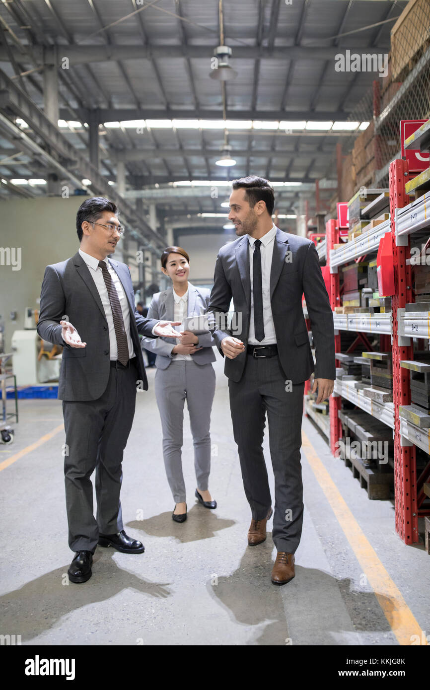 Business people talking in the factory Stock Photo - Alamy