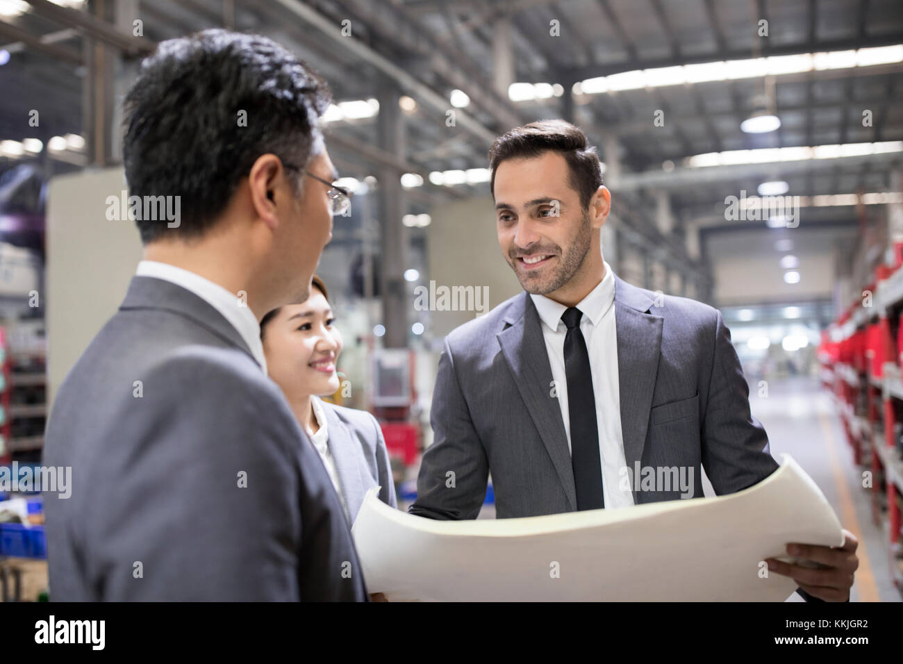 Business people talking in the factory Stock Photo - Alamy