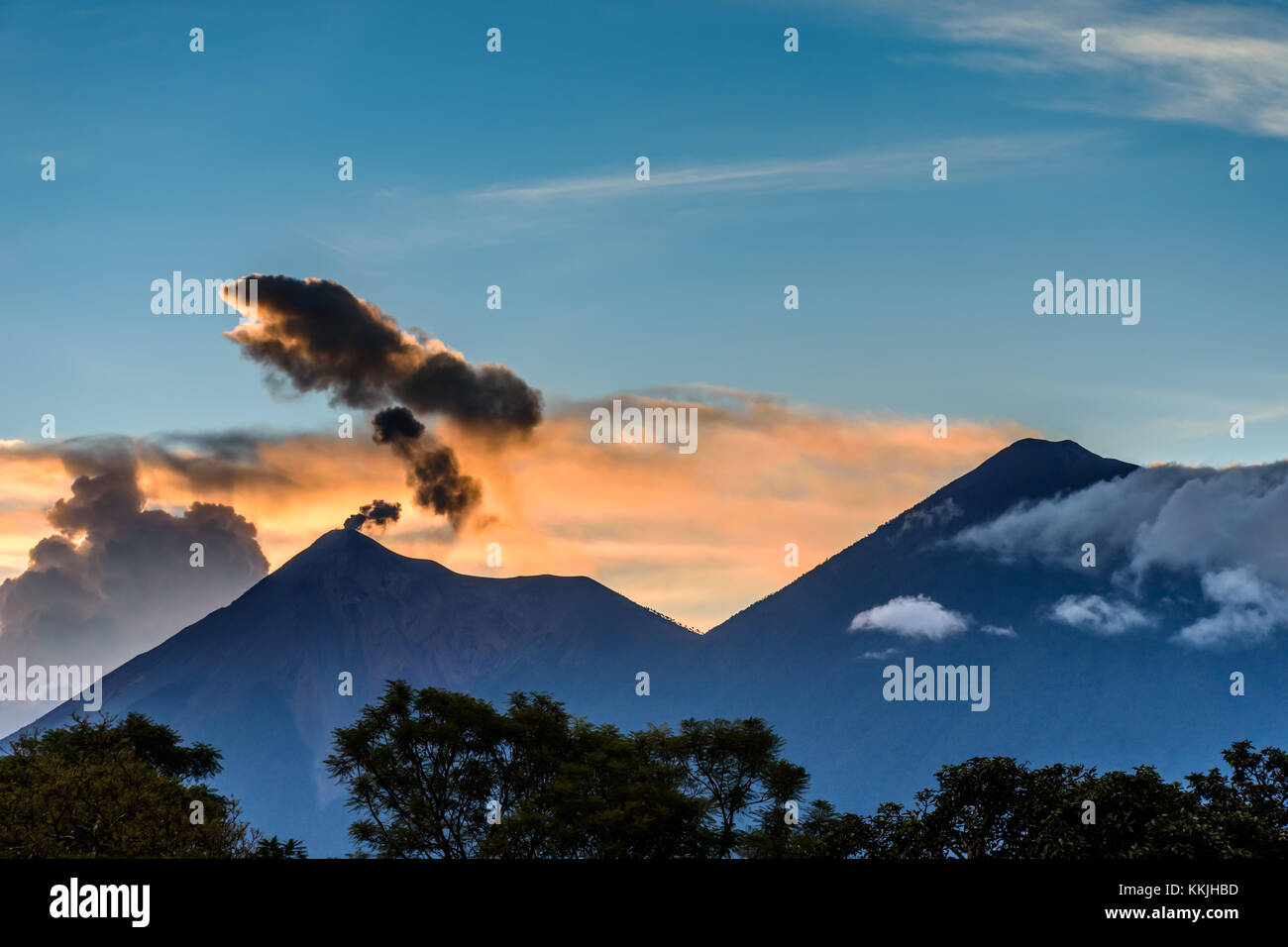 Orange sunset behind Fuego volcano & Acatenango volcano, near Antigua ...