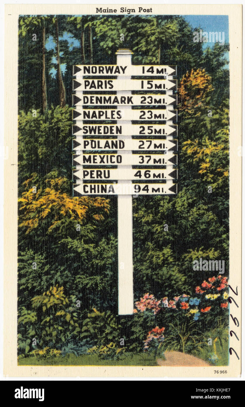 This photograph depicts a roadside sign post in Maine, likely ...