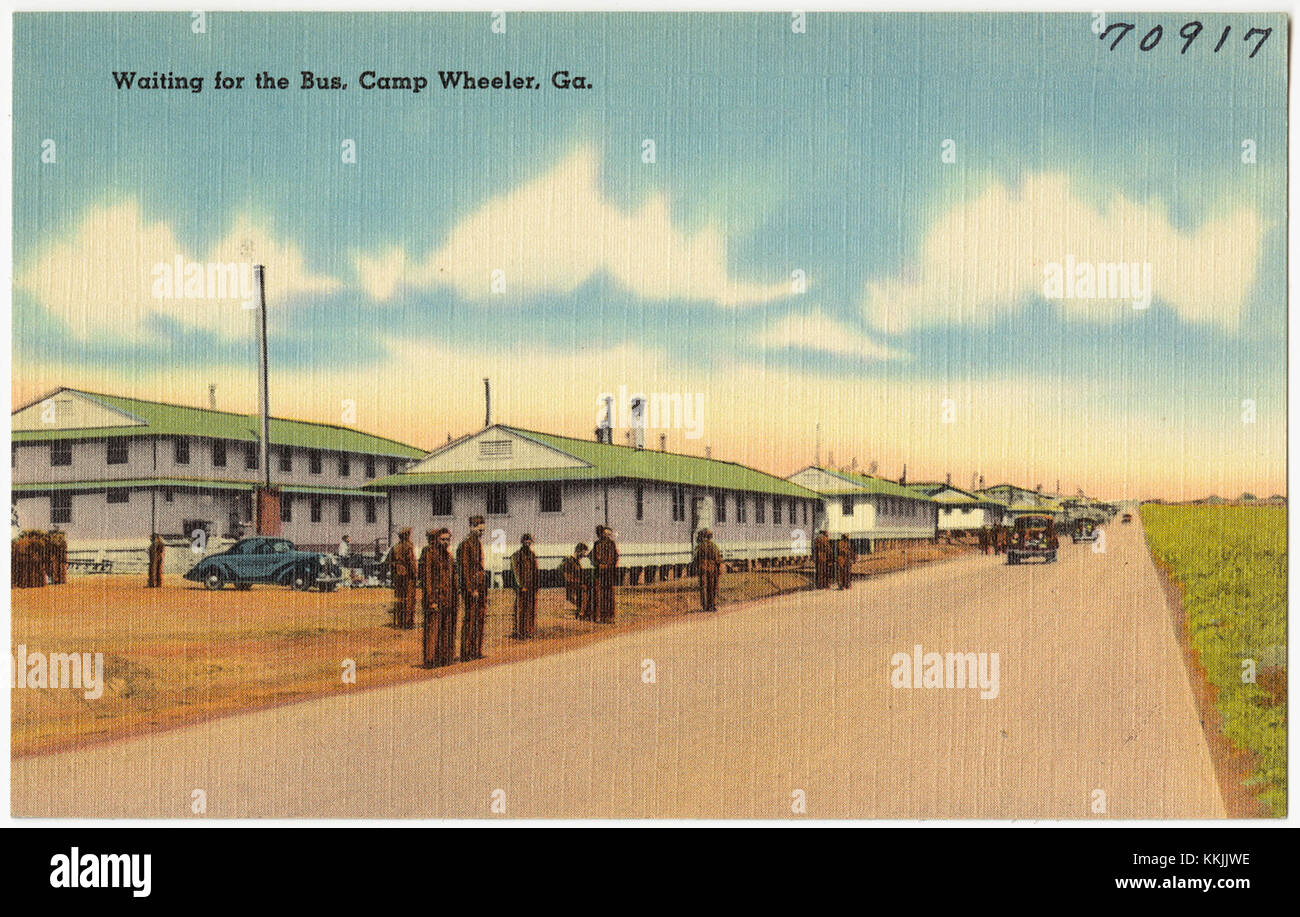 This image shows soldiers waiting for the bus at Camp Wheeler, Georgia ...