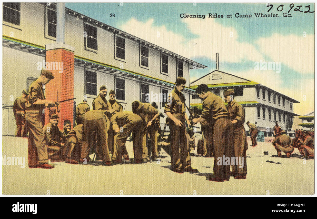 This photograph shows soldiers cleaning rifles at Camp Wheeler, Georgia ...