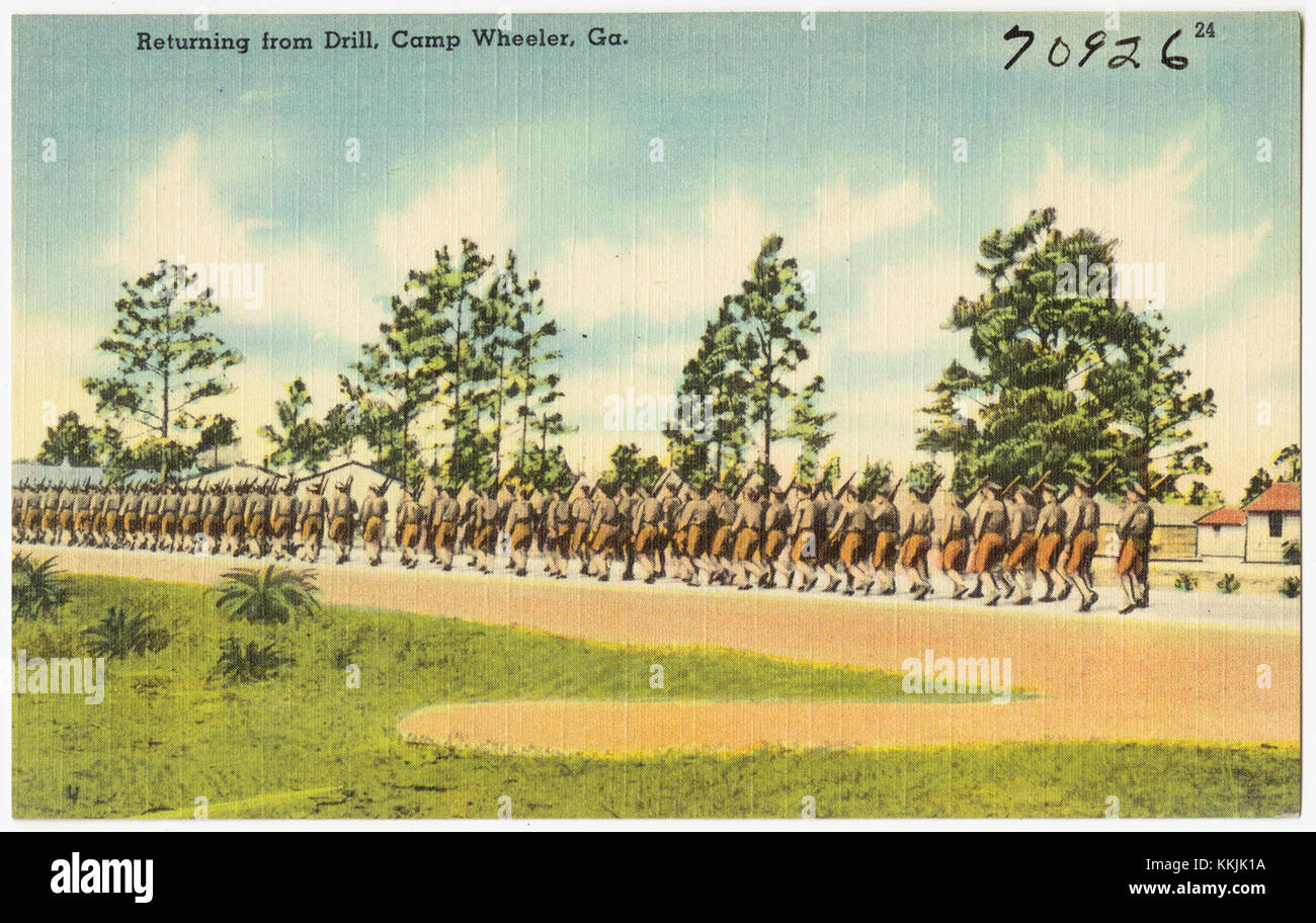 This photograph depicts soldiers returning from drill at Camp Wheeler ...