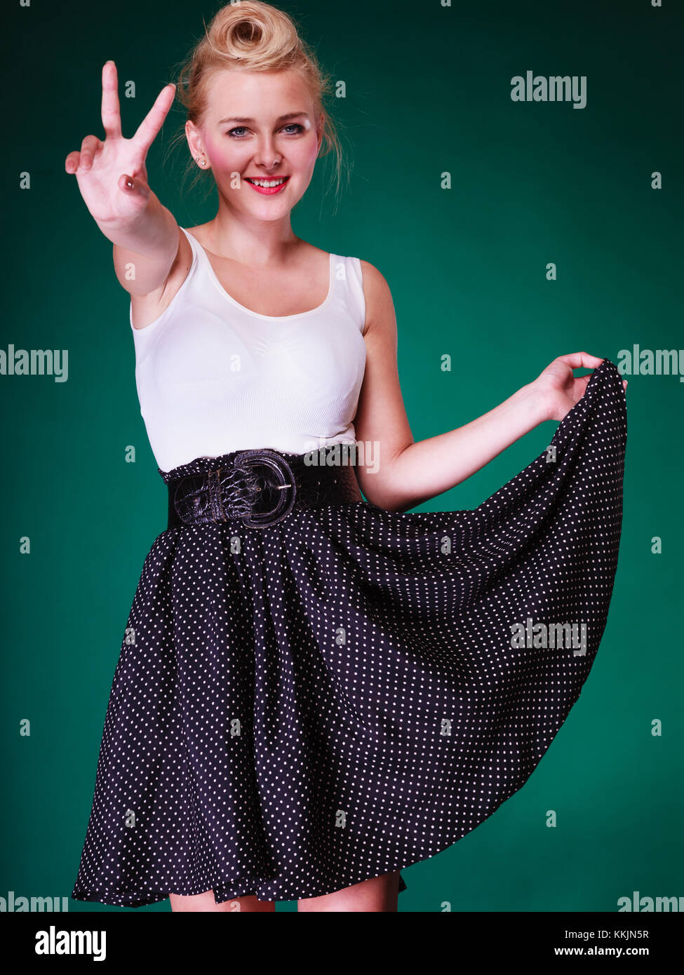 Signs, gestures concept. Lovely young pinup girl in retro black and ...