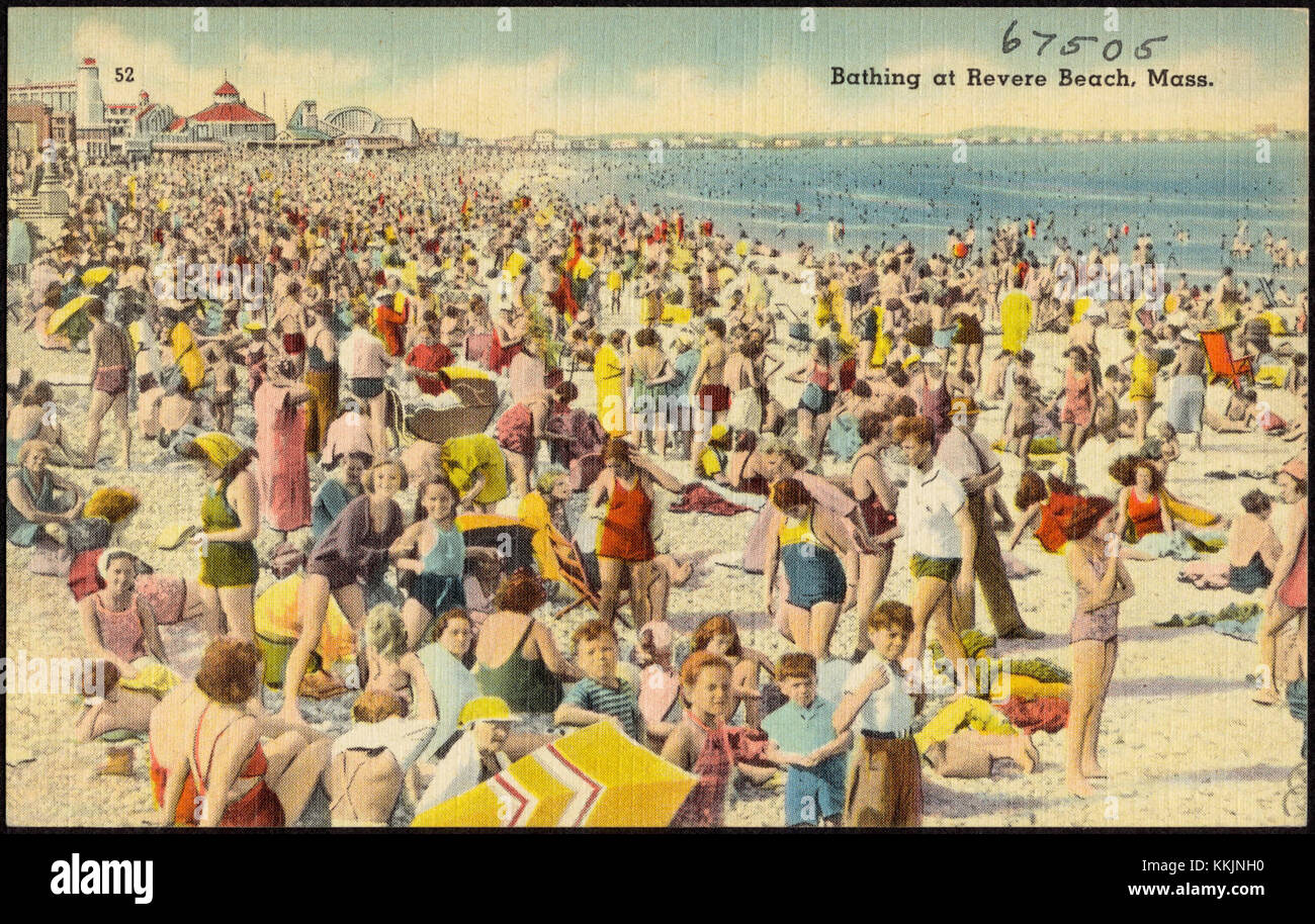 This photograph captures a scene of people bathing at Revere Beach ...