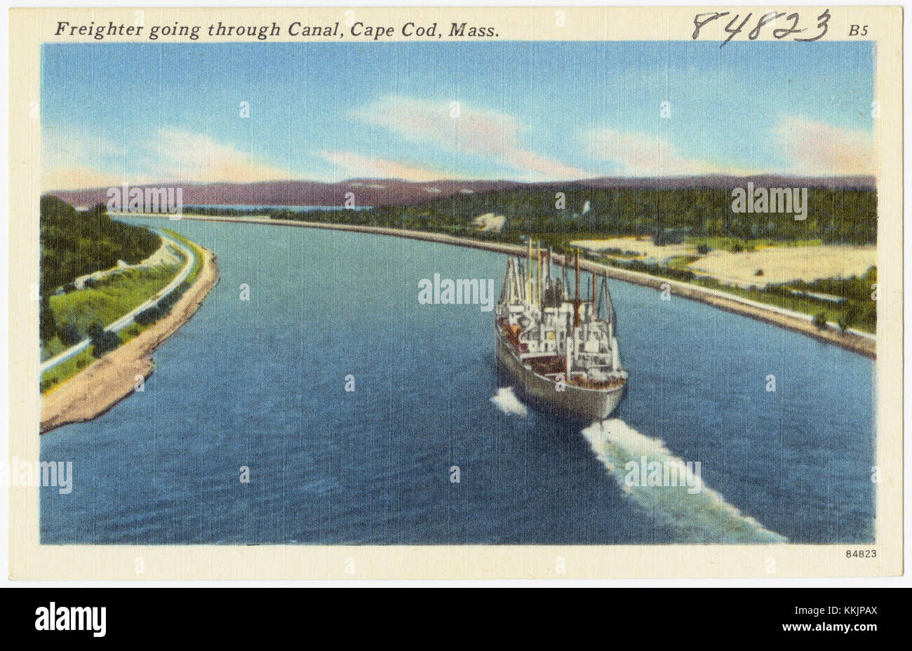 A freighter navigating through the Cape Cod Canal in Massachusetts ...