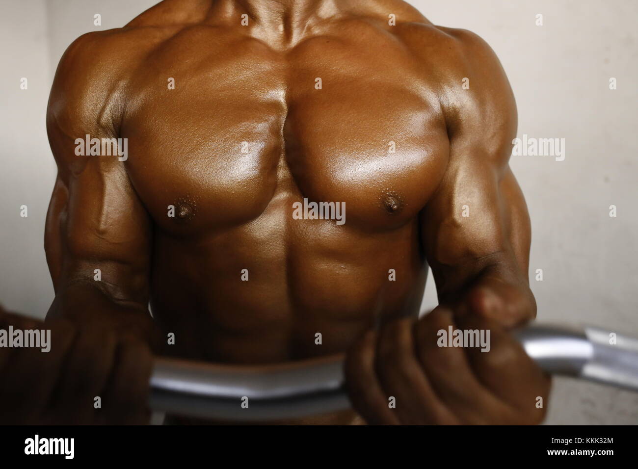 Dhaka, Bangladesh. 30th Nov, 2017. A Bodybuilder warms up backstage ...