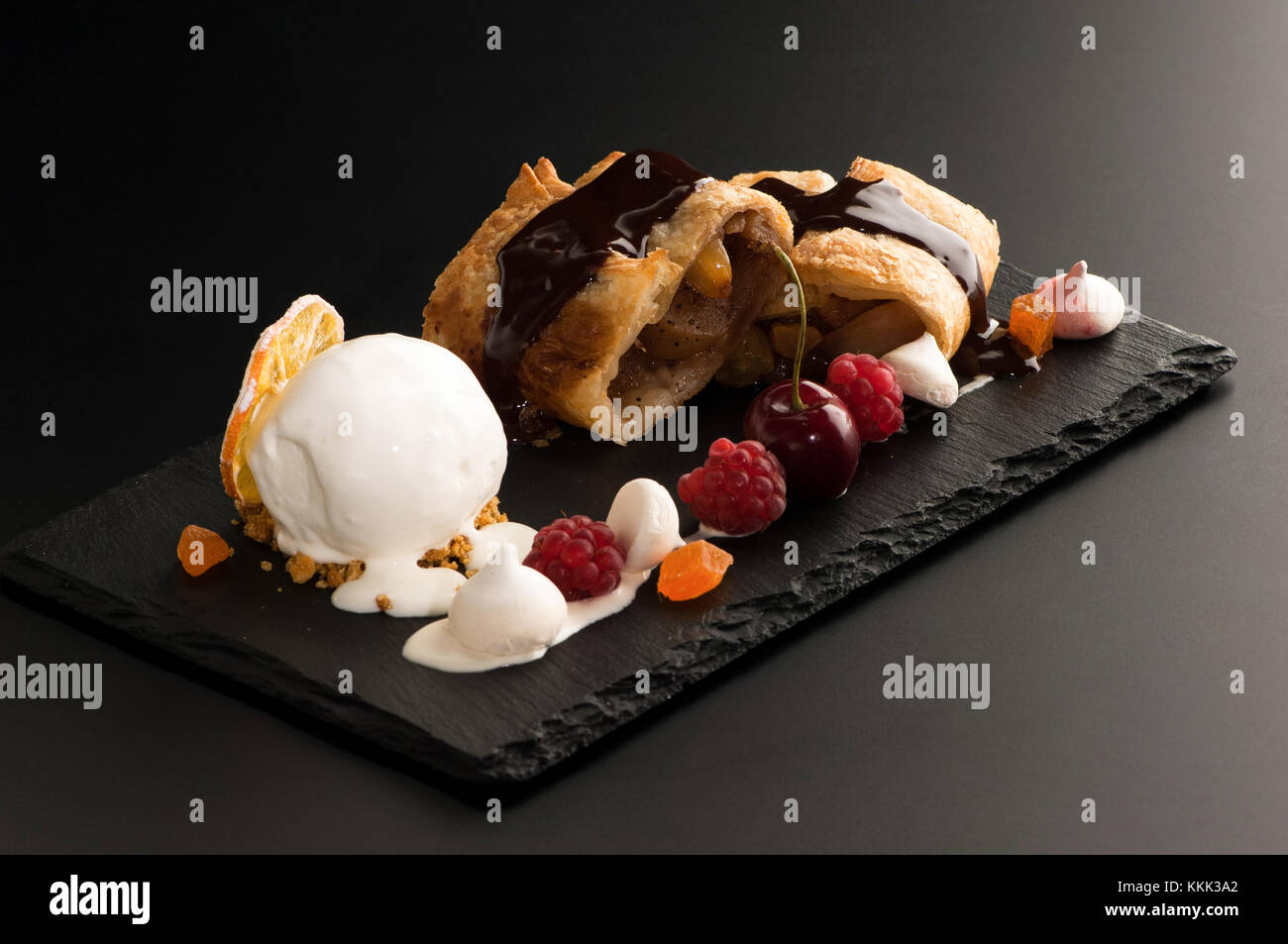 cake with berries on many decorative stone dark background Stock Photo ...