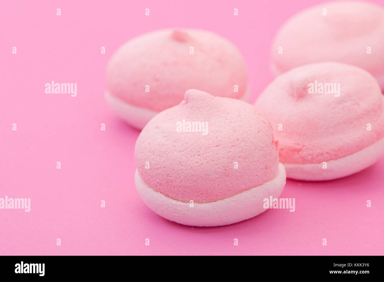 pink round shape cookies on a pink background Stock Photo - Alamy