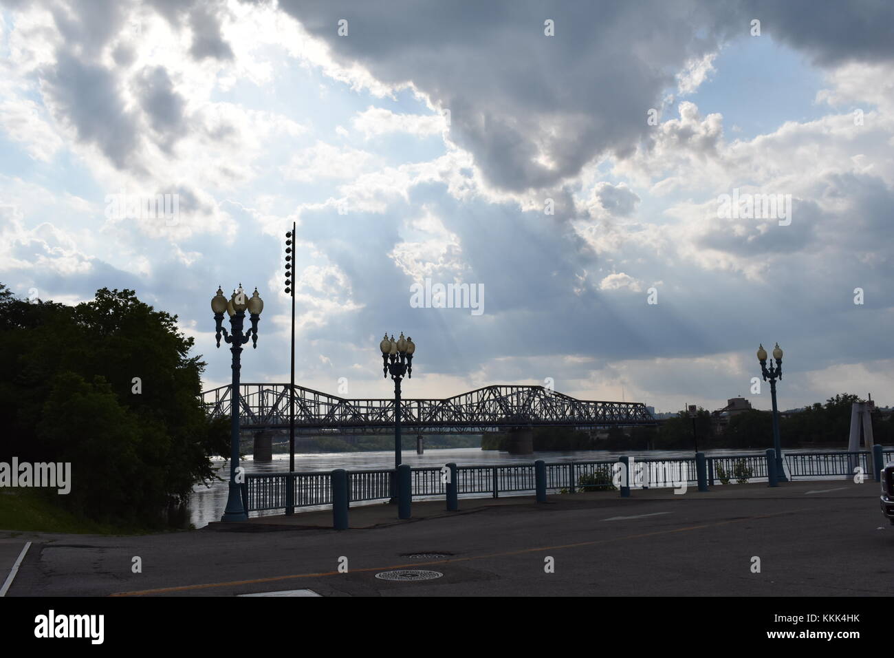 Railroad bridge with Rays shining down Stock Photo - Alamy