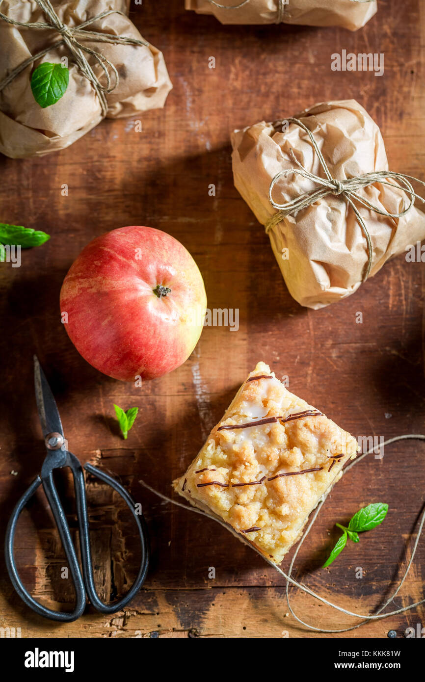 Sweet take away apple pie packed in a grey paper Stock Photo - Alamy