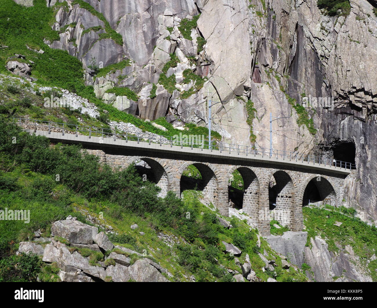 Scenic stony rail bridge in swiss Alps in SWITZERLAND near Andermatt ...