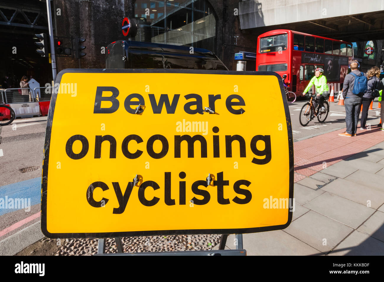 England, London, Beware Oncoming Cyclists Warning Sign Stock Photo - Alamy