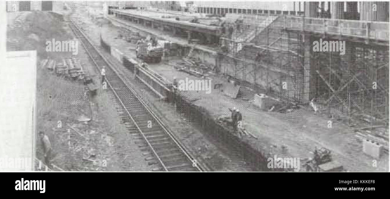 The photograph depicts the construction of the control house and access ...