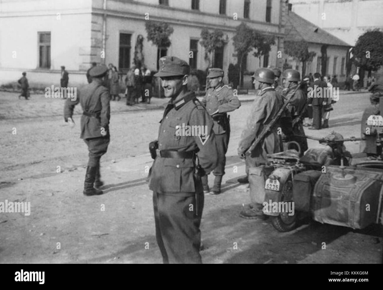 This photograph depicts German and Russian soldiers strolling through ...