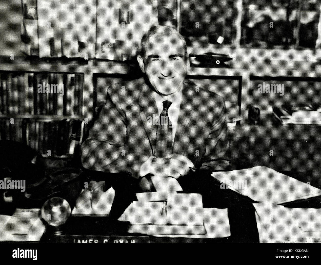 James C. Ryan, photographed at his desk in 1960, is a prominent figure ...