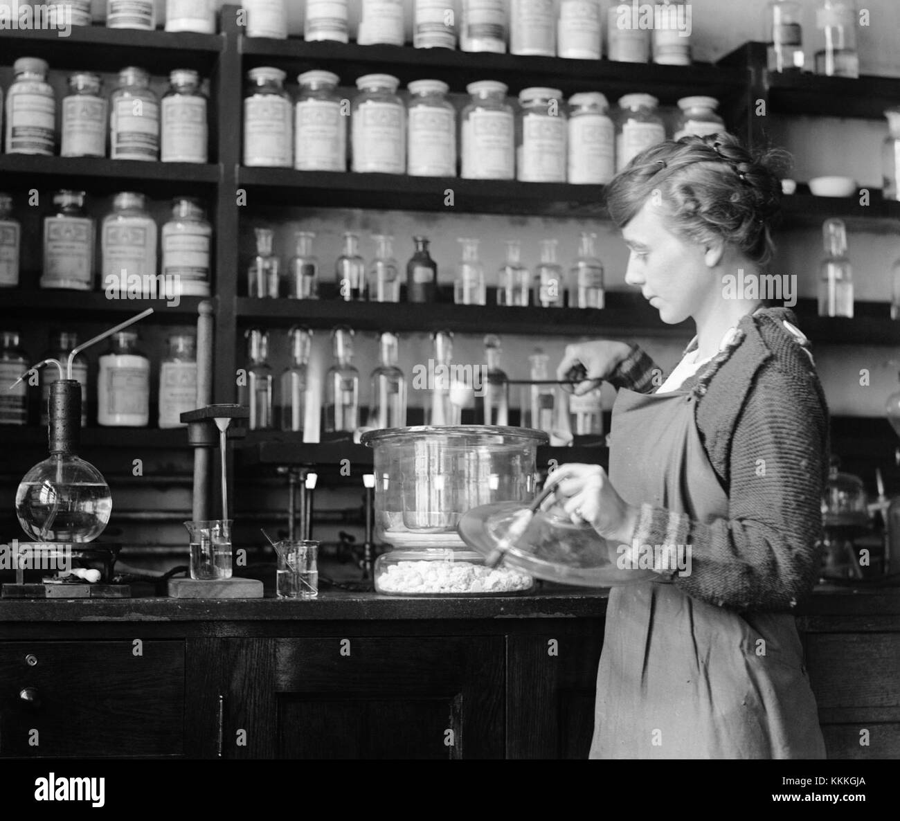 This photograph shows Margaret D. Foster, a scientist, working in a ...