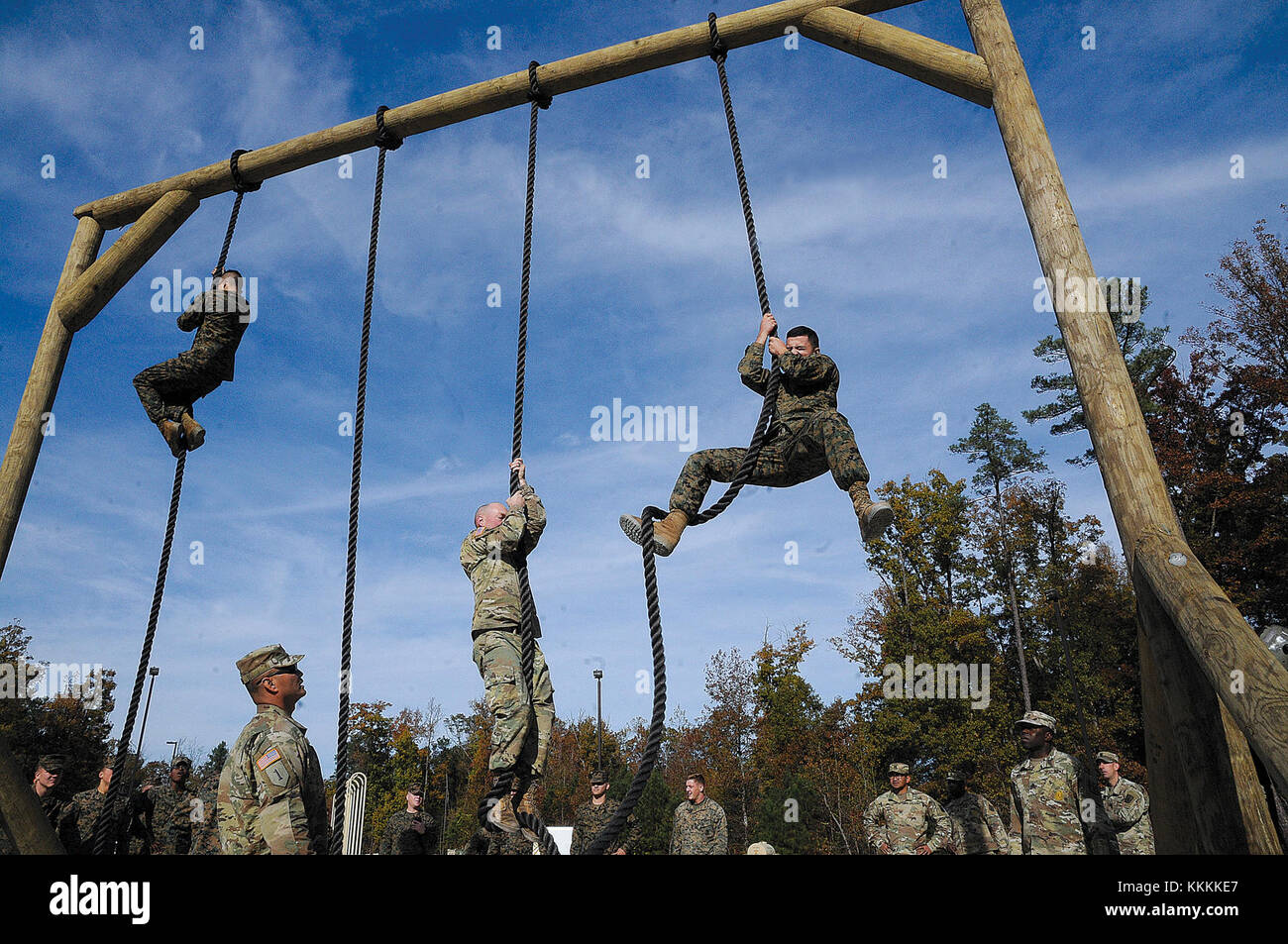 Soldiers and Marines make their way up the rope obstacle of the new ...