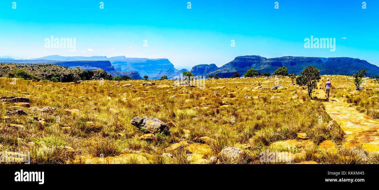 Panorama view of a Senior woman walking to the Three Rondavels ...