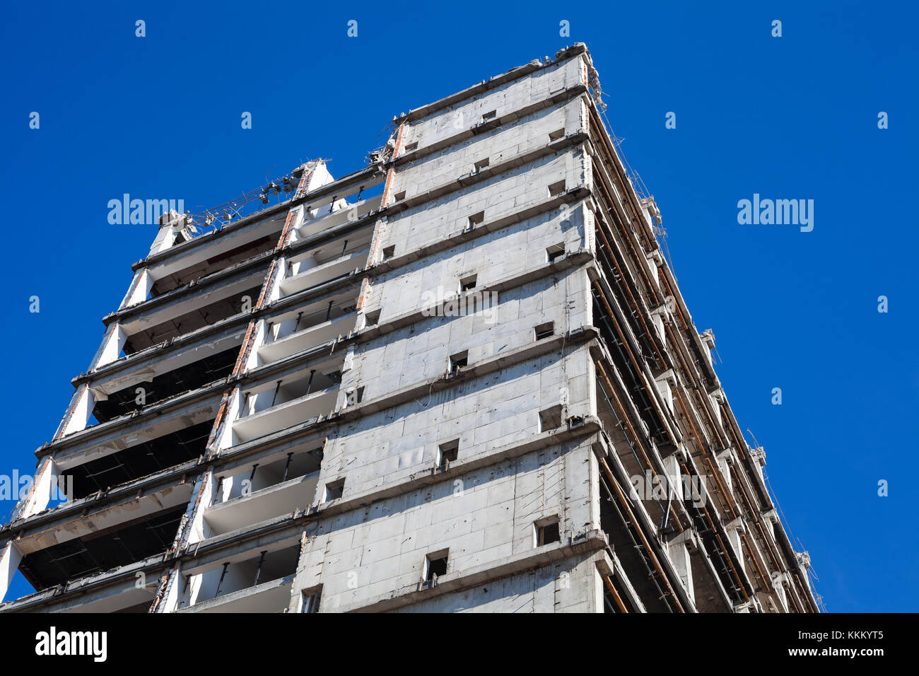 Partially demolished building against clear blue sky Stock Photo - Alamy