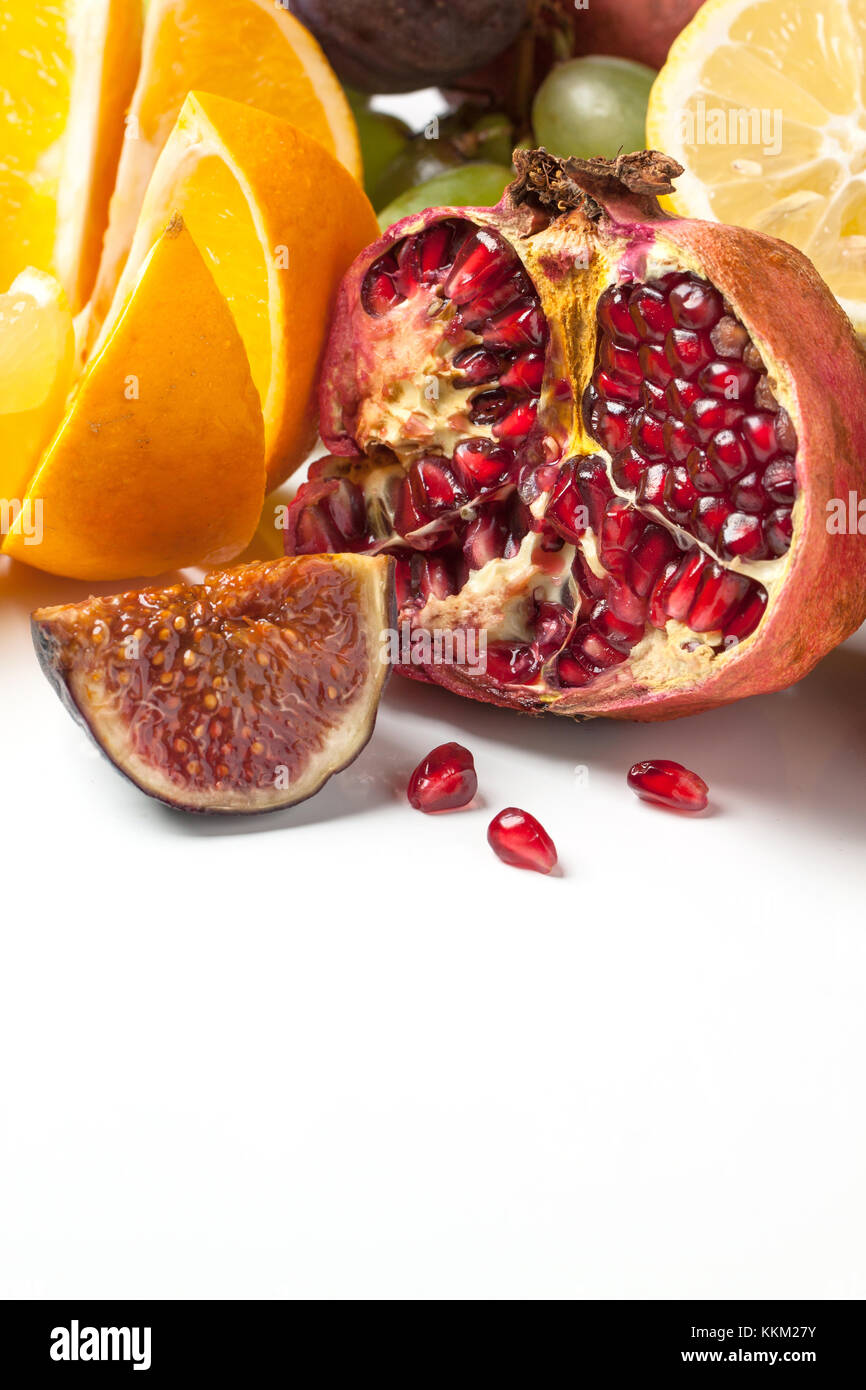 Group of fresh sliced fruits over white Stock Photo - Alamy