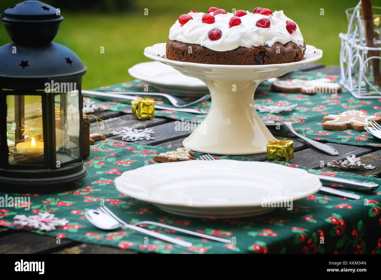 Outdoor Christmas table setting with chocolate cherry cake. See series ...