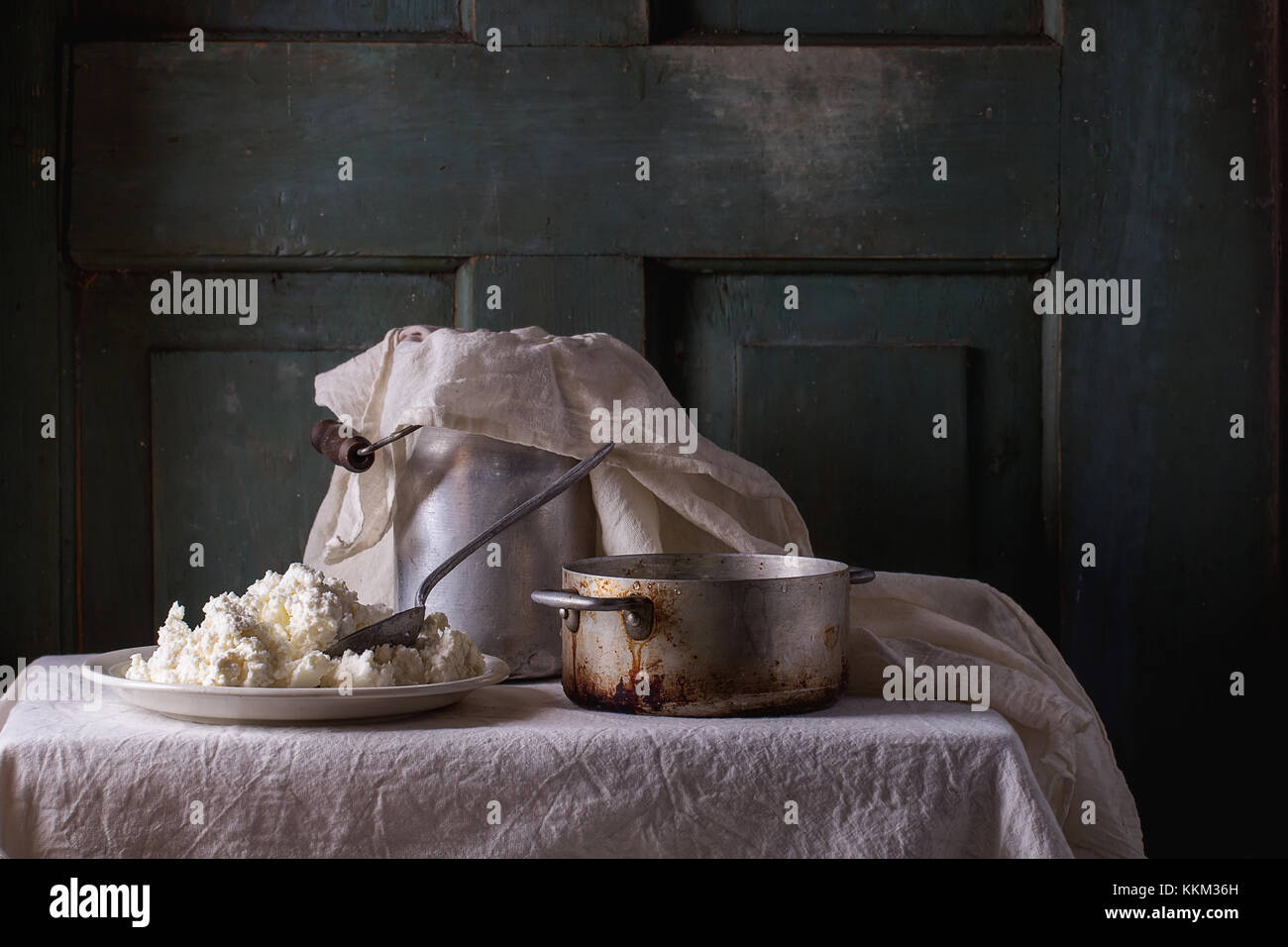 Plate of homemade cottage cheese, served with vintage aluminum pan and ...