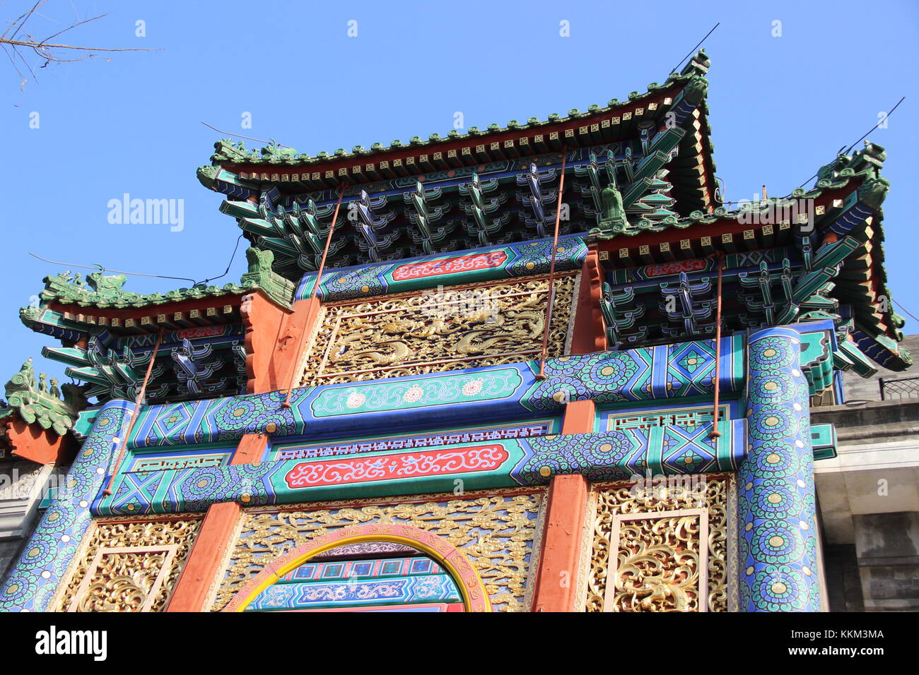 Painted decorations on Chinese store front Stock Photo - Alamy