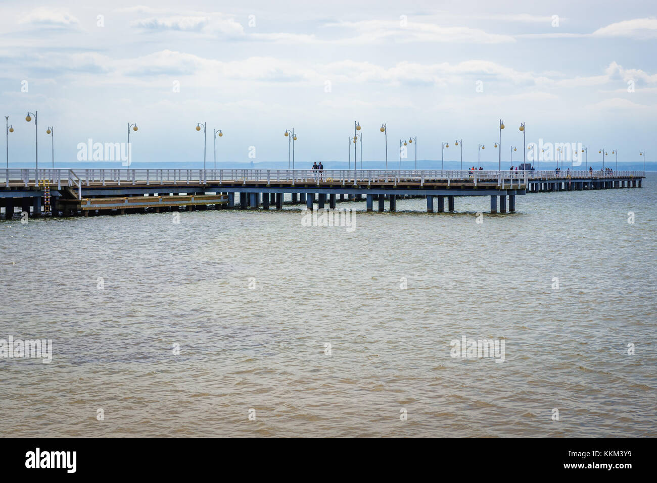 Pier on Bay of Puck beach seen from beach in Jurata town on Hel ...